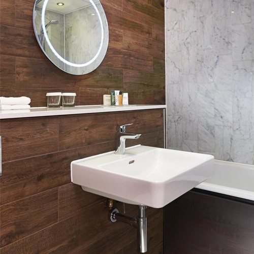 Porcelain sink and lavatory fixtures for hotel accissible bathroom