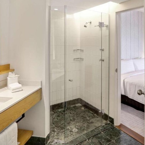 Glass shower door in Shangri-La hotel Cairns