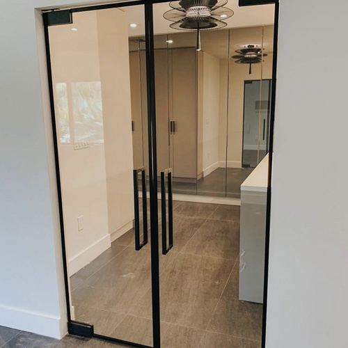 Interior door with clear glass and matte black hardware
