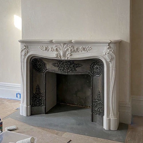 Louis XV fireplace surround in white statuary marble