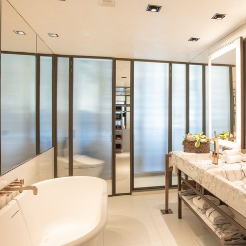 Ribbed glass moving wall in bathroom