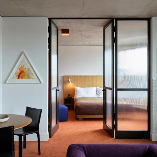 Room dividing wall by glass door and partition in ACE hotel room ...