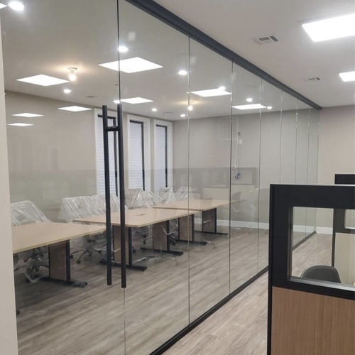 full height glass wall in workspace conference room