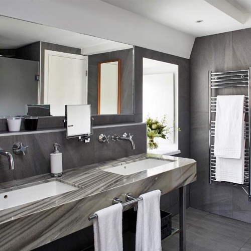 metal base bath vanity with marble top and apron