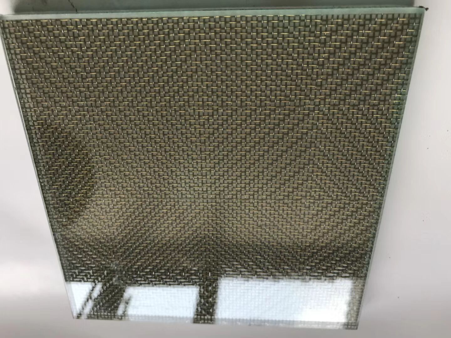 Custom wire mesh laminated glass solution for commercial office space